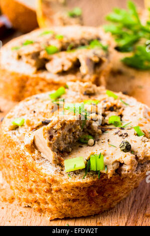 Tapas. Bread with meat paste, herbs and spices Stock Photo - Alamy