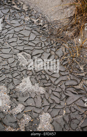 Dried mud puddle with dry cracks and traces of rain drops, Highway 24 ...