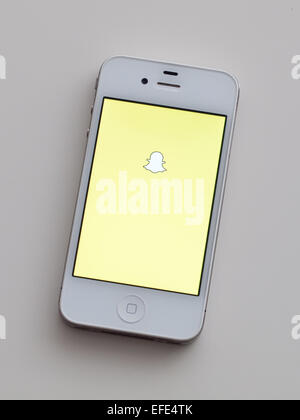 A view of the logo and homescreen of the Snapchat mobile app on an ...
