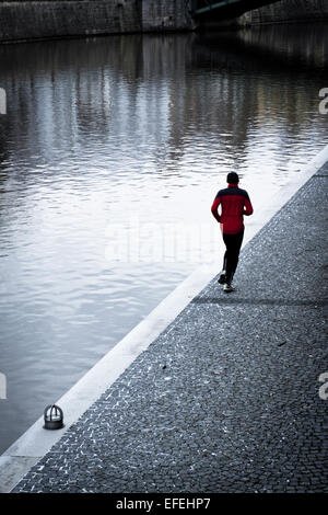 Runner by river Stock Photo - Alamy