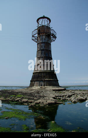 Cast iron lighthouse at Whiteford Point on the Gower Peninsula opposite ...