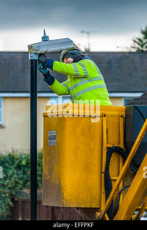 Street light maintenance — an electrical engineer carries out his work ...