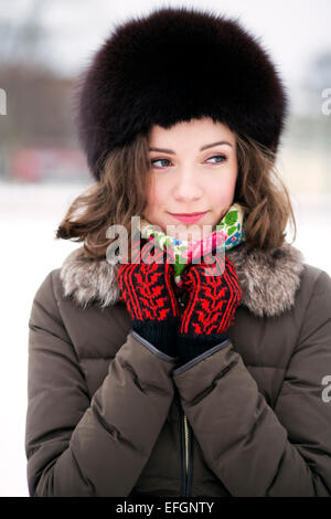 Red wool hat and black gloves with snow Stock Photo - Alamy