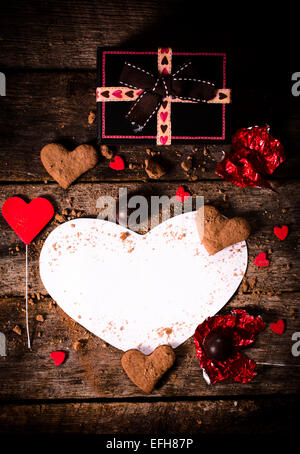 St. Valentine card concept with heart shaped decor on wooden background ...
