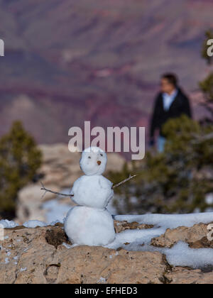 Snowman on the edge Stock Photo - Alamy
