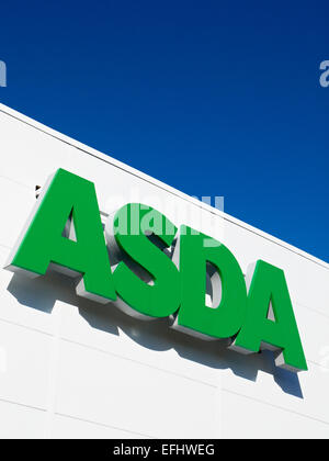 Asda sign logo with blue sky above Stock Photo - Alamy