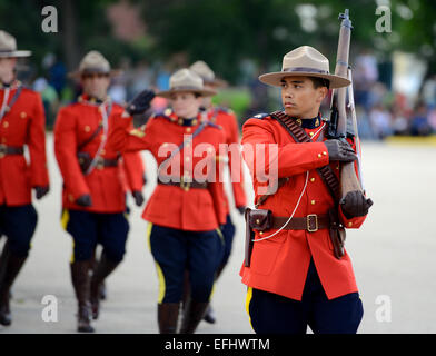 Mounties marching in the Sunset Retreat Ceremony at the Royal Canadian ...