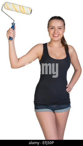 Photo of young woman with paint roller standing near staircase Stock ...