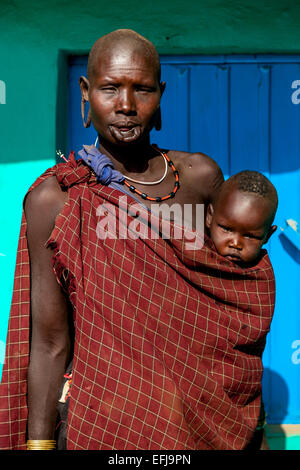 Portrait Of A Woman and Baby From The Mursi Tribe, Jinka Town, Omo ...