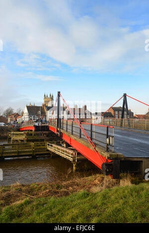 selby road swing bridge closing over the river ouse with selby abbey in ...