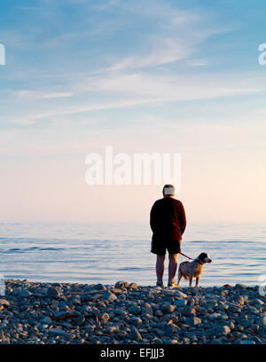 Middle age man standing over isolated background making fish face with ...