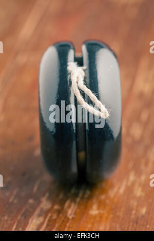 Old fashioned wooden toys. Yo yo, cup and ball and a top and whip a ...