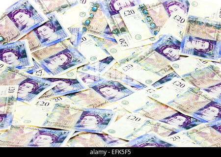 Currency banknotes spread across frame british pound sterling in ...