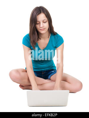casual teenager with laptop. over white background Stock Photo - Alamy