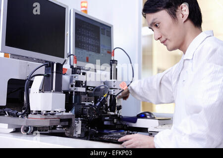 Technician working in LED factory Stock Photo - Alamy