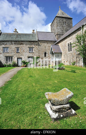 Penmon Priory complex under blue sky and sunshine, Anglesey, Wales, UK ...