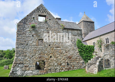 Penmon Priory complex under blue sky and sunshine, Anglesey, Wales, UK ...