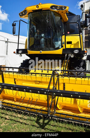 front view of a combine harvester harvesting wheat Stock Photo - Alamy
