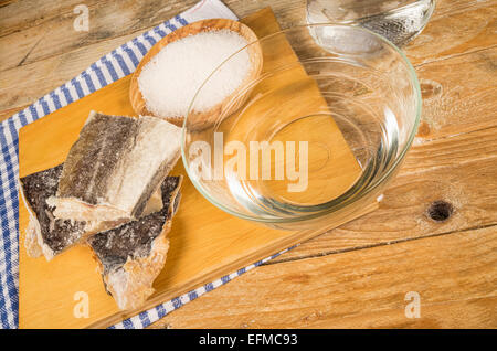 Several pieces of dried cod being desalted in fresh water Stock Photo ...
