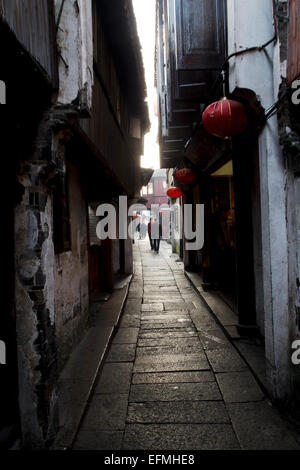 A narrow walkway in a traditional Chinese garden in Suzhou, China. The ...