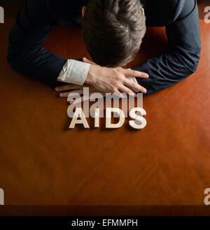 Word AIDS and devastated man composition Stock Photo - Alamy