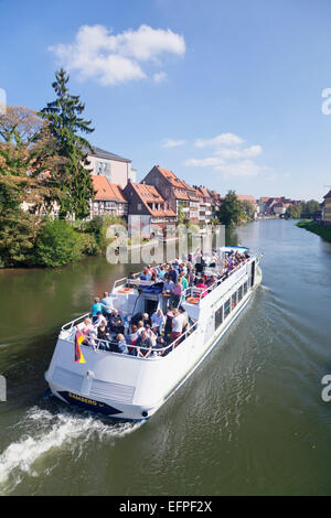 Excursion boat on the Regnitz river, Little Venice at back, Bamberg ...