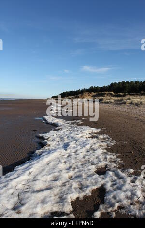 Snow at high water mark Tentsmuir forest Fife Scotland February 2015 ...