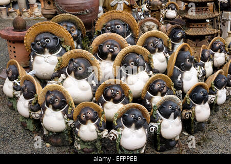 A collection of 'tanuki' (Japanese raccoon dog) statues. You can often ...