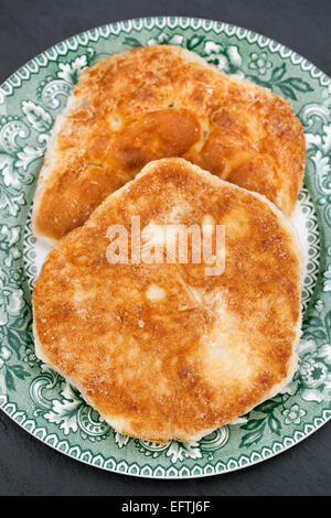 A buttery, also known as a roll, rowie, rollie, or Aberdeen roll which ...