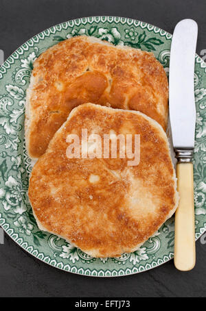 A buttery, also known as a roll, rowie, rollie, or Aberdeen roll which ...