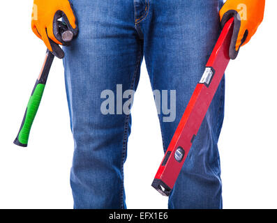 Hands holding construction tools on beige background Stock Photo - Alamy