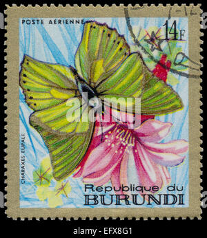 BURUNDI - CIRCA 1968: a stamp printed in the Burundi shows Man Writing ...