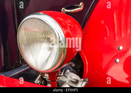 Headlight of a red old-timer Stock Photo - Alamy