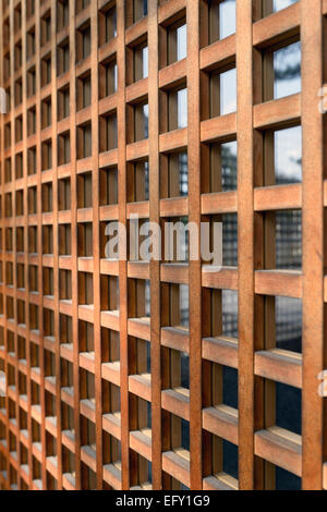 A traditional wooden Japanese house with a lattice front on a back ...