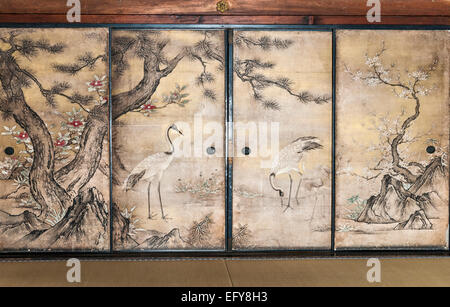 Traditional Japanese room interior with painted sliding doors and ...