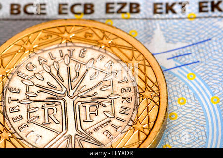 French 1 Euro coin on €5 Euro note Stock Photo - Alamy