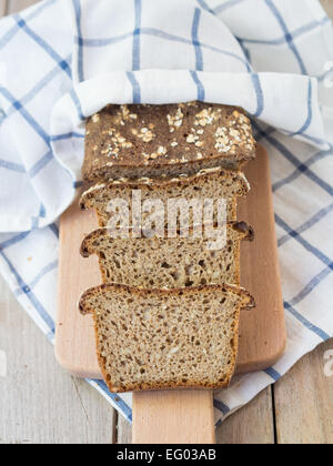 Sliced rye bread with knife Stock Photo - Alamy
