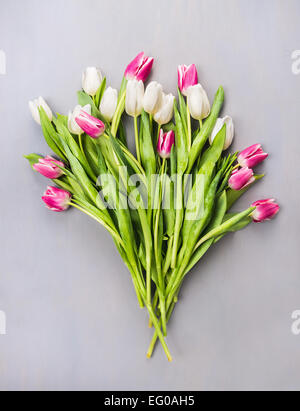 tulips light wooden background. the view from top. with space for text ...