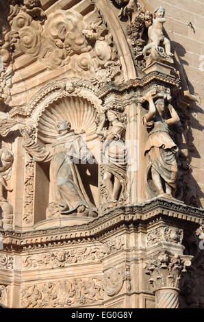 Monument with relief and sculpture of St. Francis with wolf figure at ...