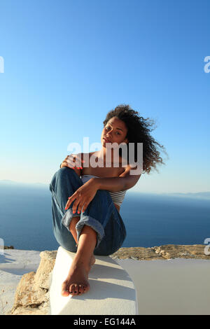 greece a young mixed race girl posing on holiday Stock Photo - Alamy