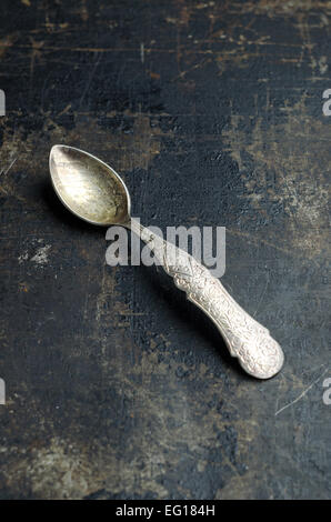 Close up of a teaspoon over dark grunge background Stock Photo - Alamy