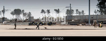 U.S. Airmen with the 353rd Special Operations Wing load a U.S. Army ...