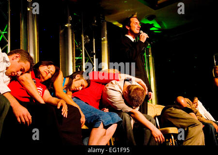 Anthony Cools hypnotizes members of the audience at his comedic ...