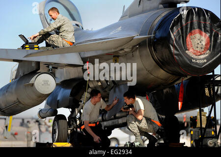 Crew chiefs from the 20th Aircraft Maintenance Unit move a drag chute ...