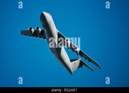 A 433rd Airlift Wing C-5 Galaxy begins to turn over the runway before ...