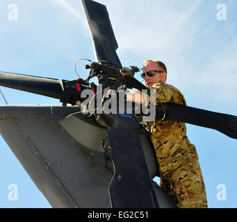 A 305th Rescue Squadron HH HH-60G Pave Hawk helicopter hovers over the ...