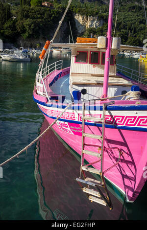 pretty party pink boat in island of corfu,greece Stock Photo - Alamy