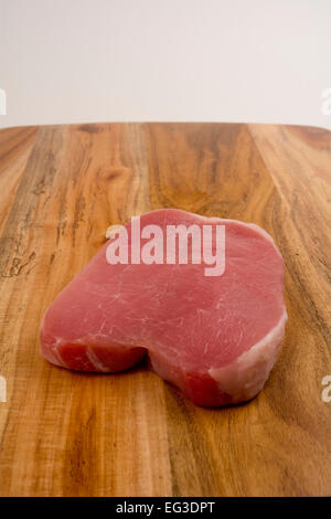 Raw pork chop meat at butchers shop Stock Photo - Alamy