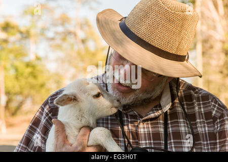 man in straw hat hold basket full of ripe vegetables Stock Photo - Alamy