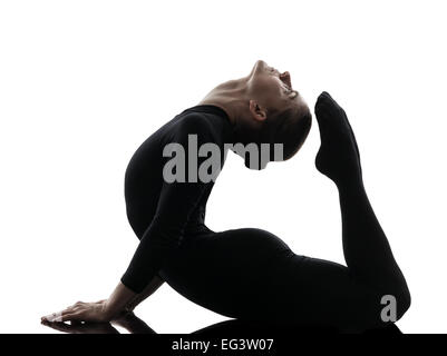 one woman contortionist practicing gymnastic yoga in silhouette on ...